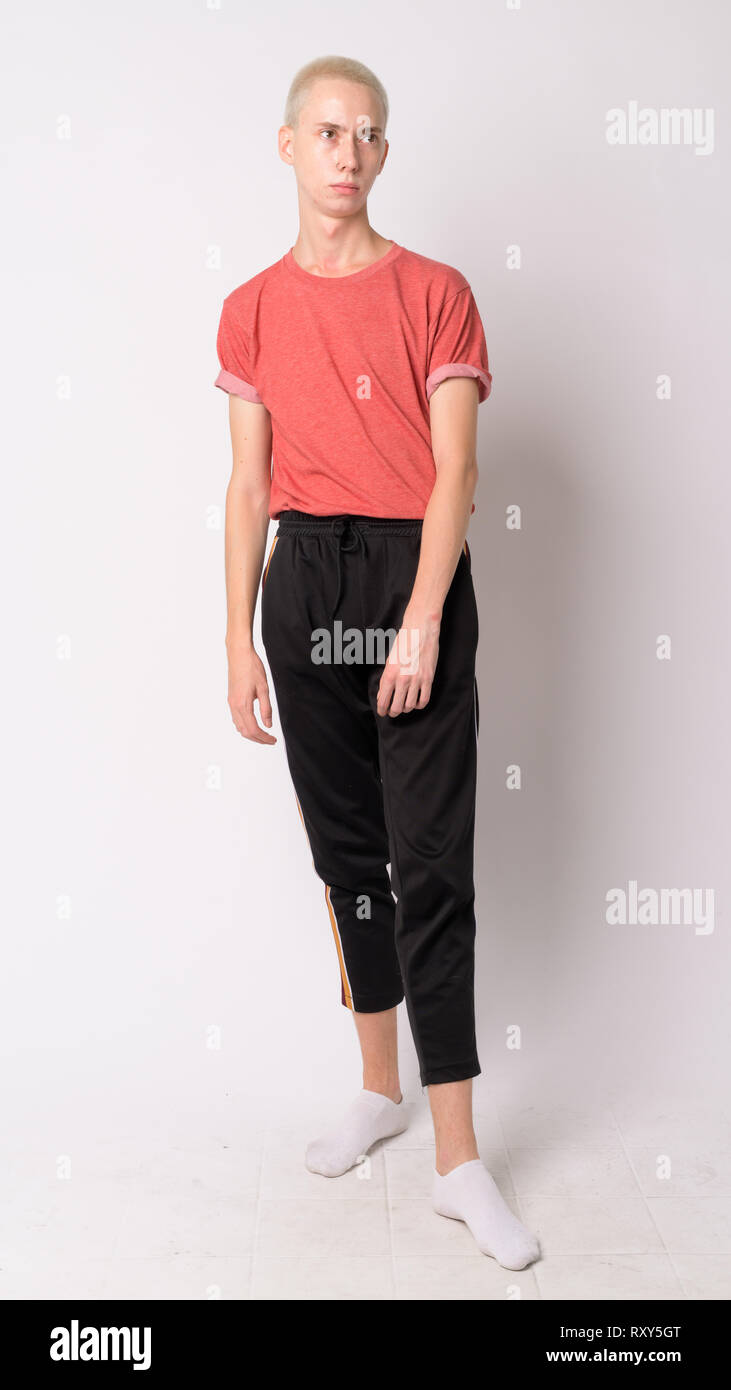 Full body shot of young handsome androgynous man thinking Stock Photo ...