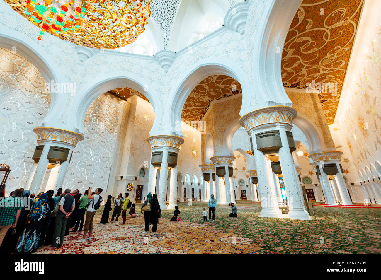 Tourists gather in the interior of Sheikh Zayed Grand Mosque, Abu Dhabi ...