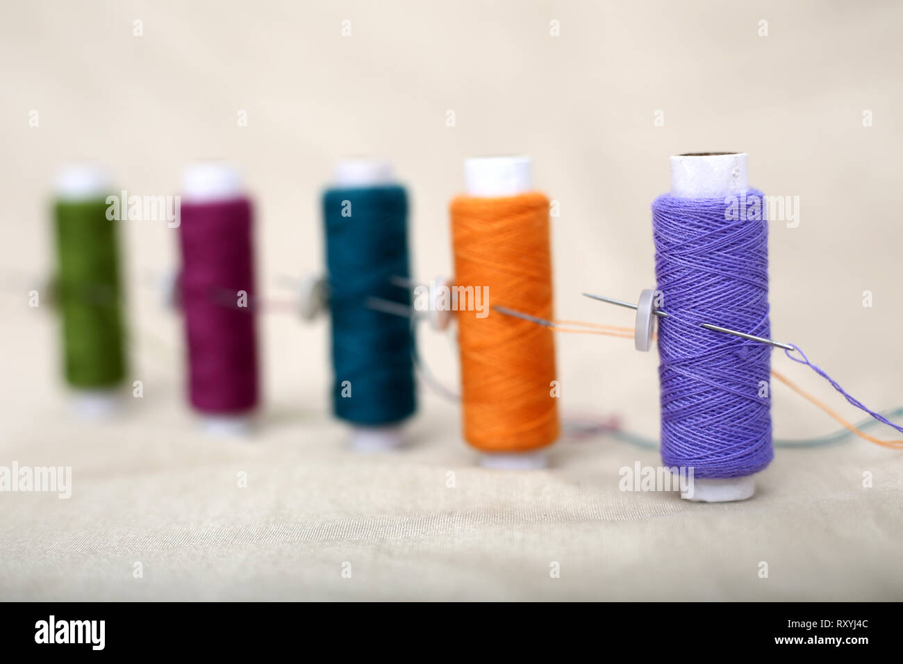 Picture of sewing thread and needle on the cloth Stock Photo - Alamy