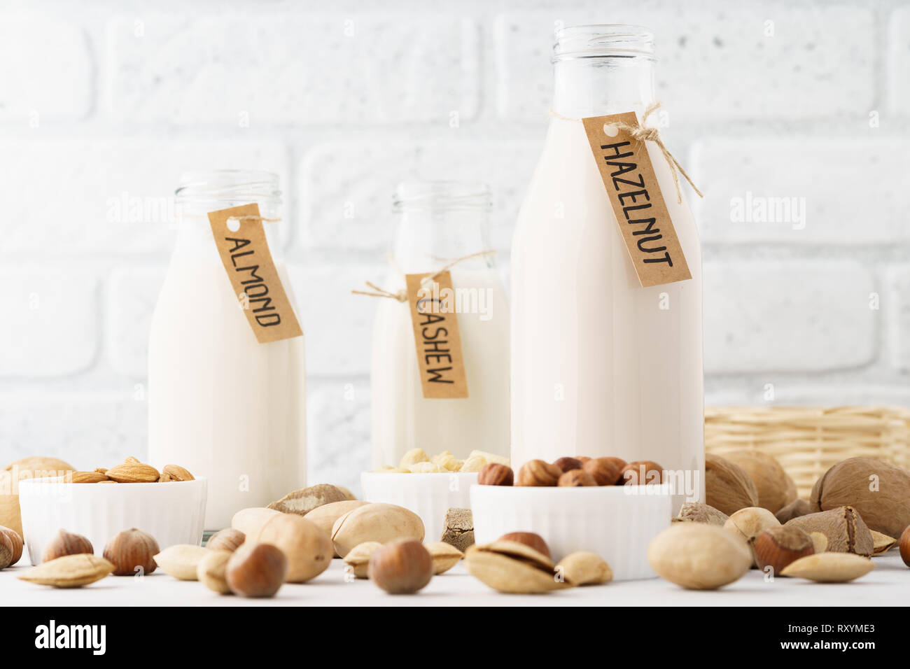 Set of various nut milk in bottles - almond, cashew, hazelnut and raw ...