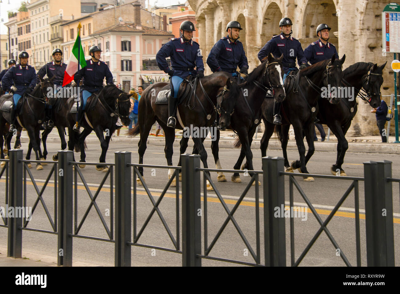 Corazzieri or Italian horse police patrolling the Colosseum in Rome ...