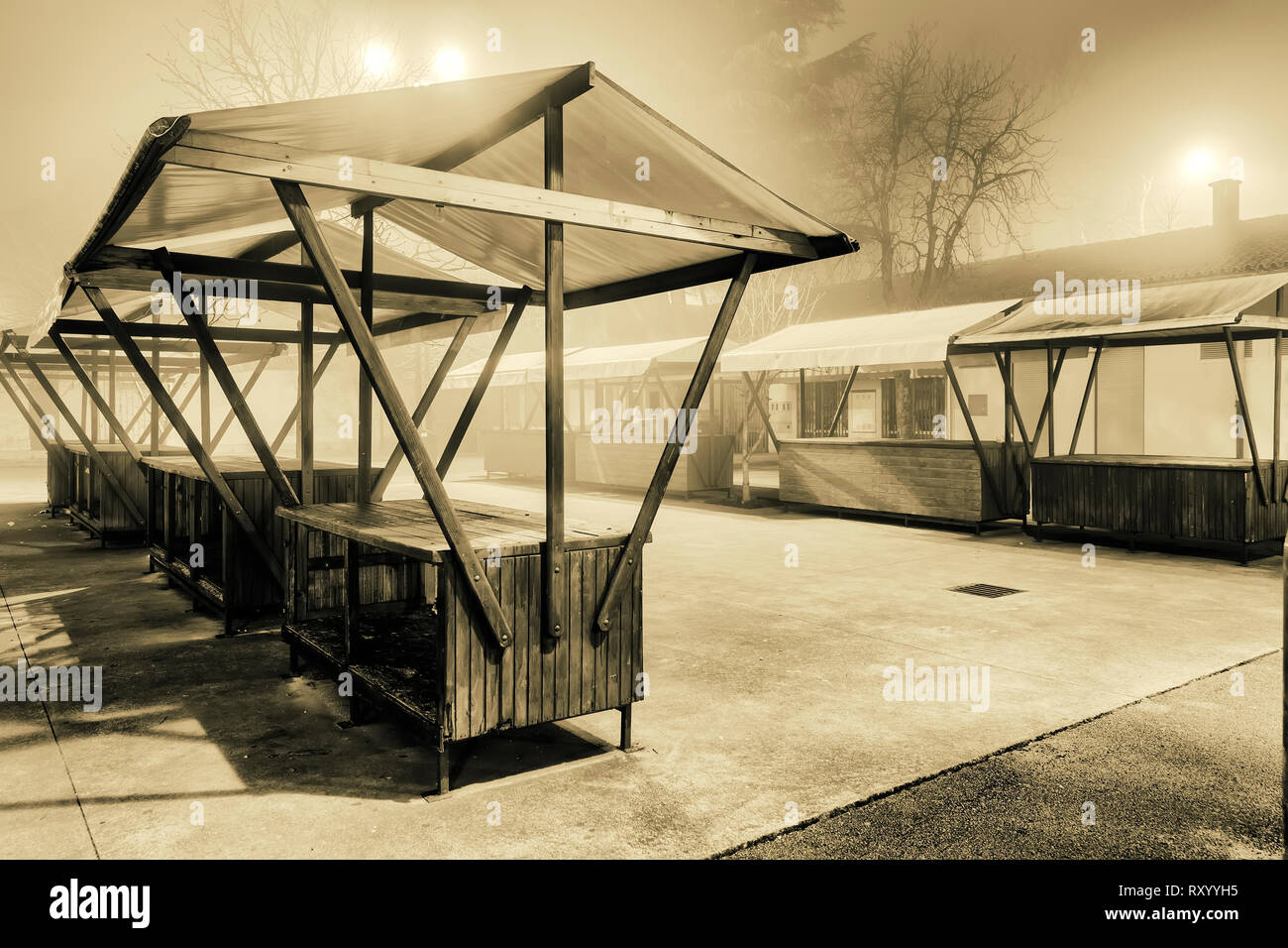 empty open market stall on foggy night Stock Photo - Alamy