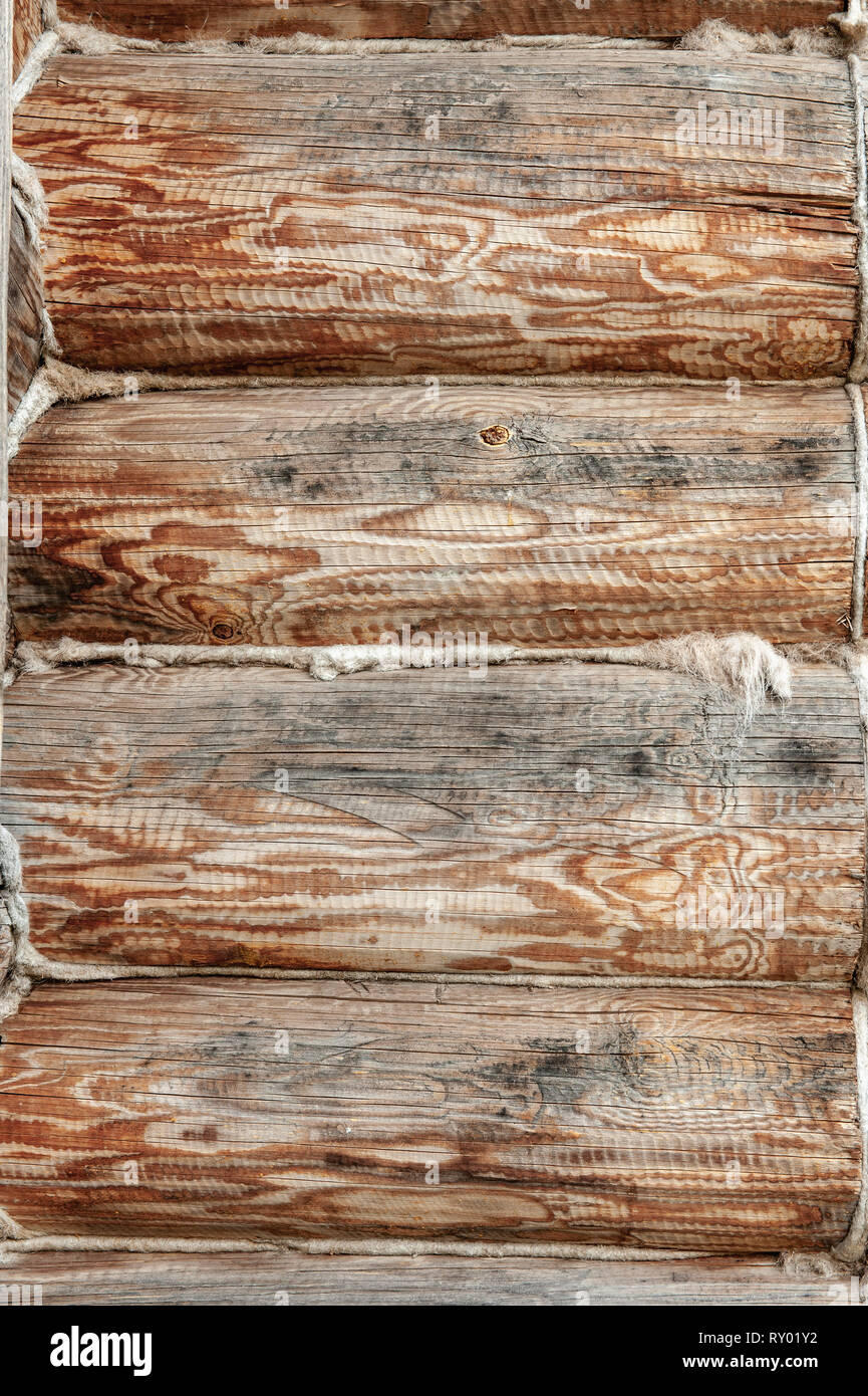 Background Textured wooden oak beams are warmed with towels in an old ...