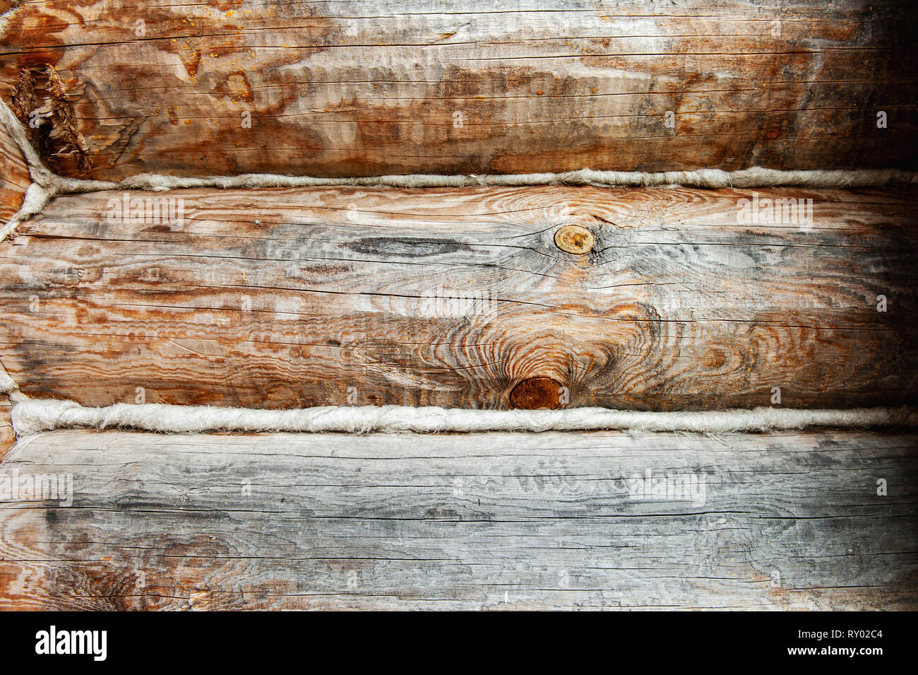 Background Textured wooden oak beams are warmed with towels in an old ...
