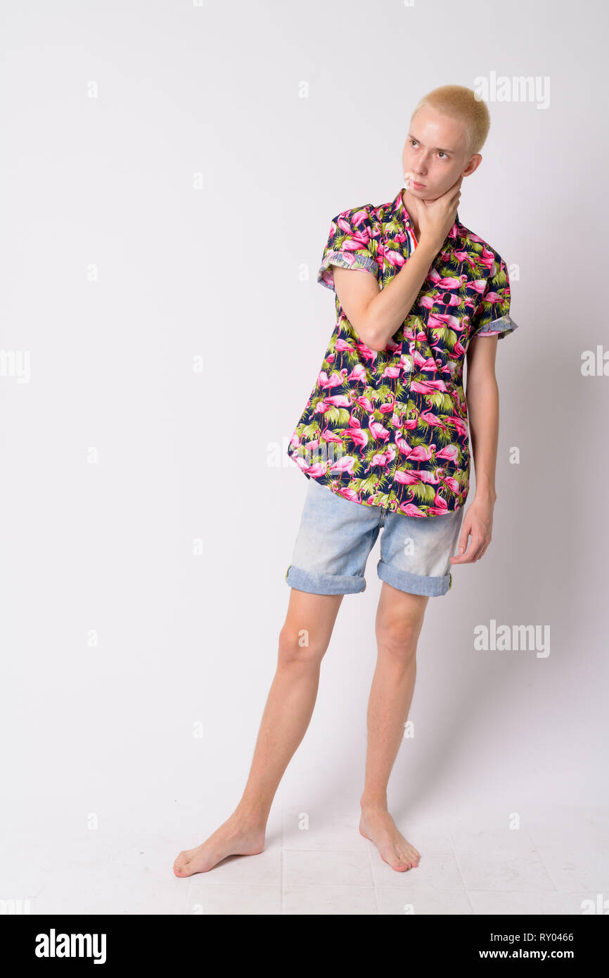 Full body shot of young androgynous tourist man thinking Stock Photo ...