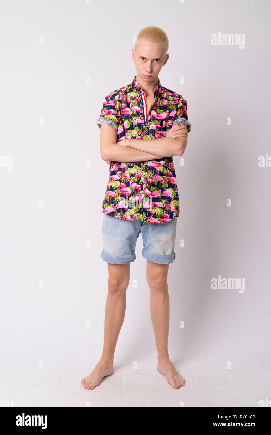 Full body shot of young androgynous tourist man with arms crossed Stock ...