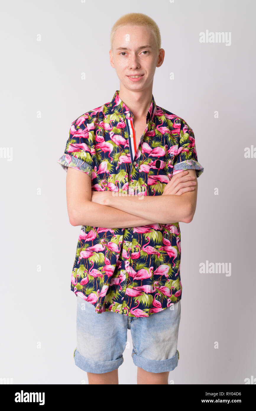 Young happy androgynous tourist man smiling with arms crossed Stock ...