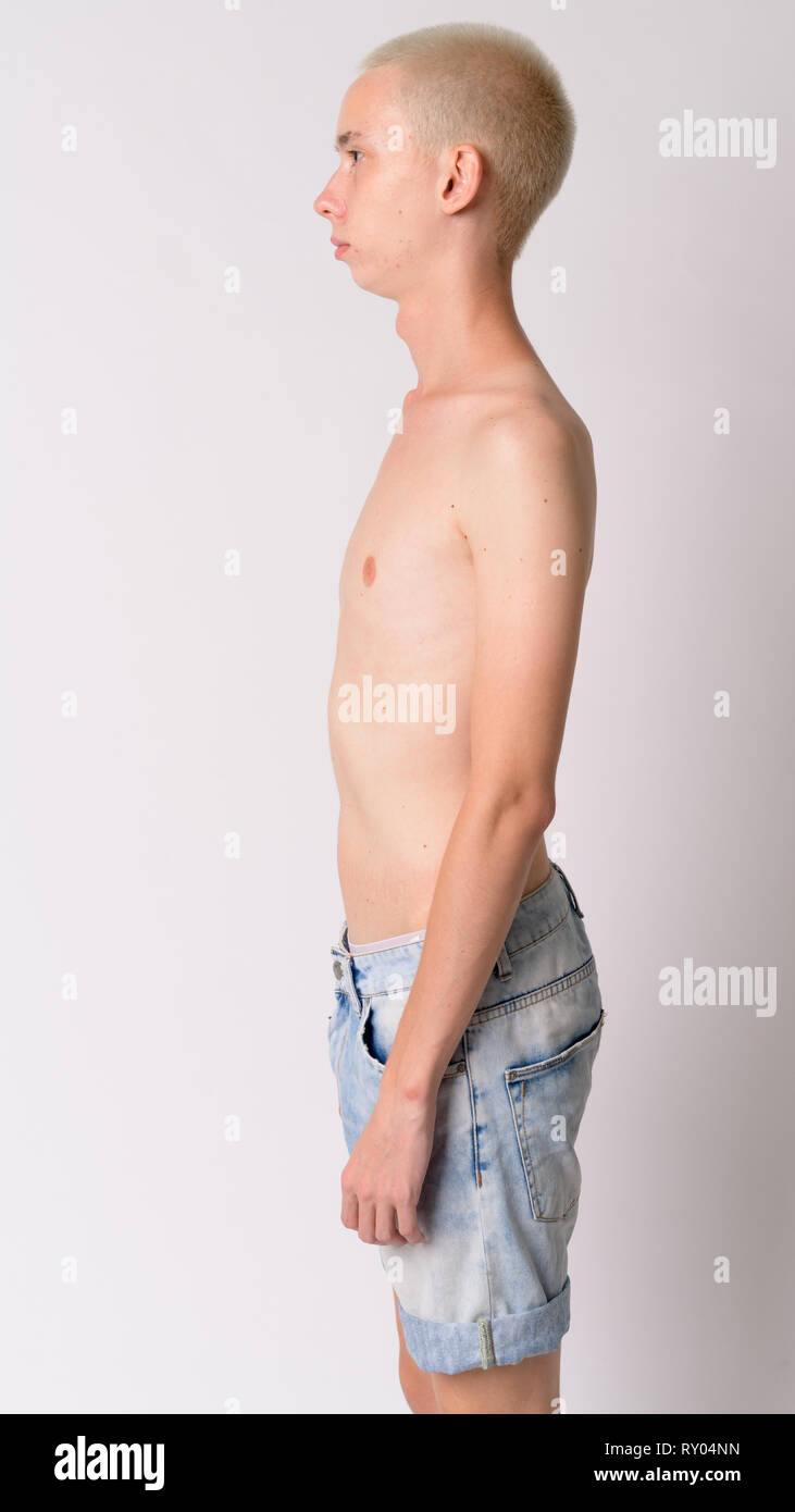 Profile view of young handsome androgynous man shirtless Stock Photo ...