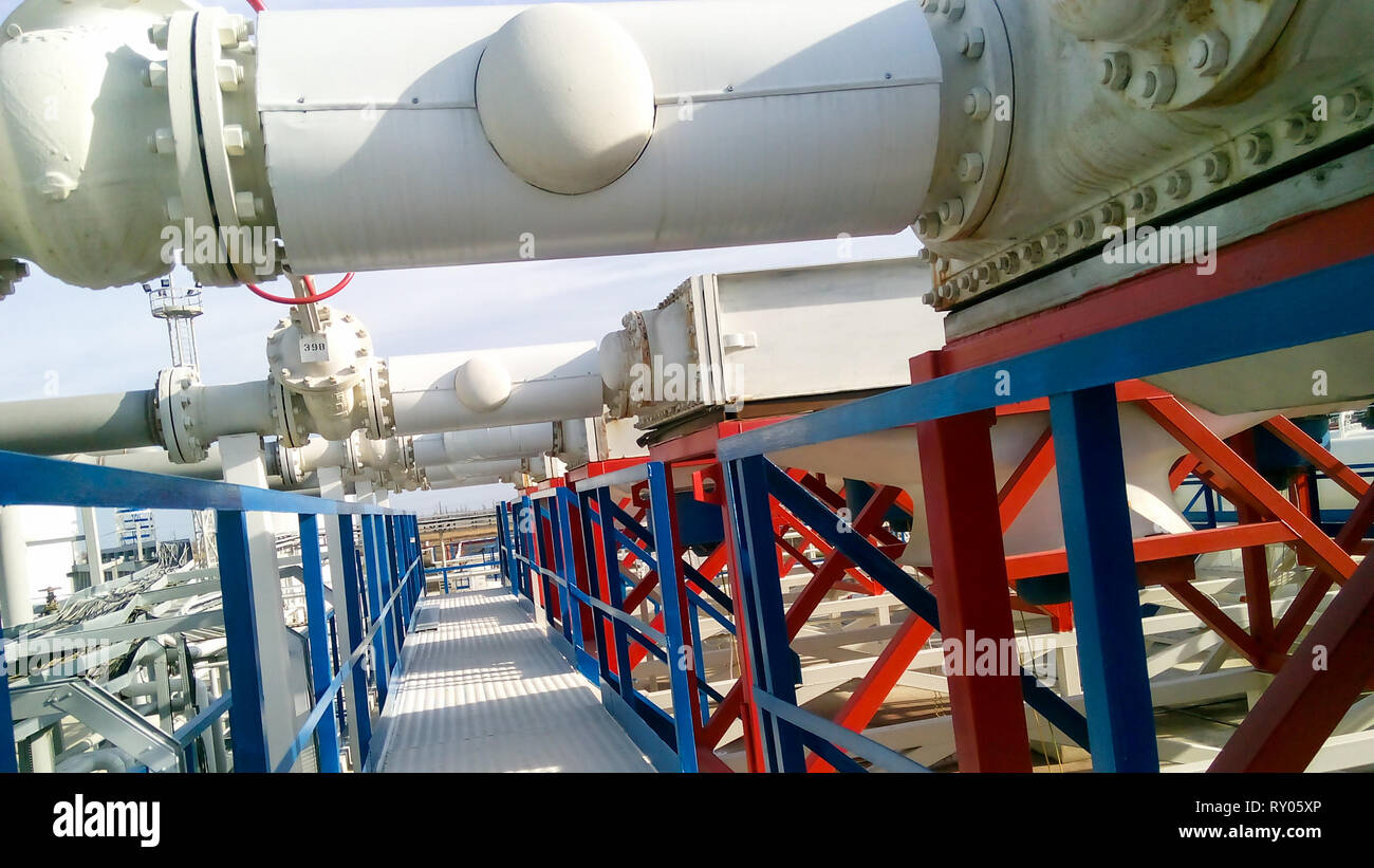 Steel service platform and stairs. Equipment refinery Stock Photo - Alamy