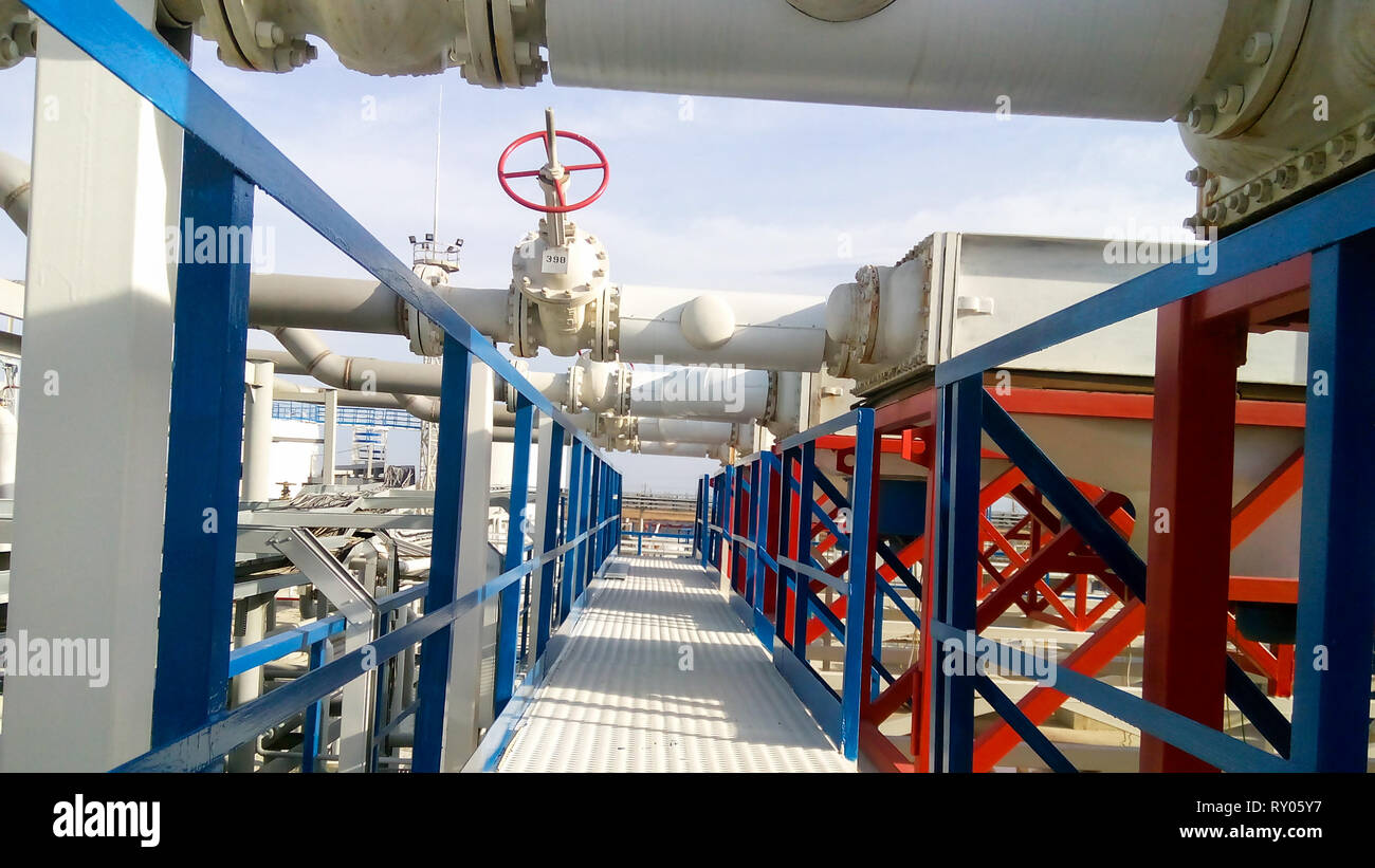 Steel service platform and stairs. Equipment refinery Stock Photo - Alamy