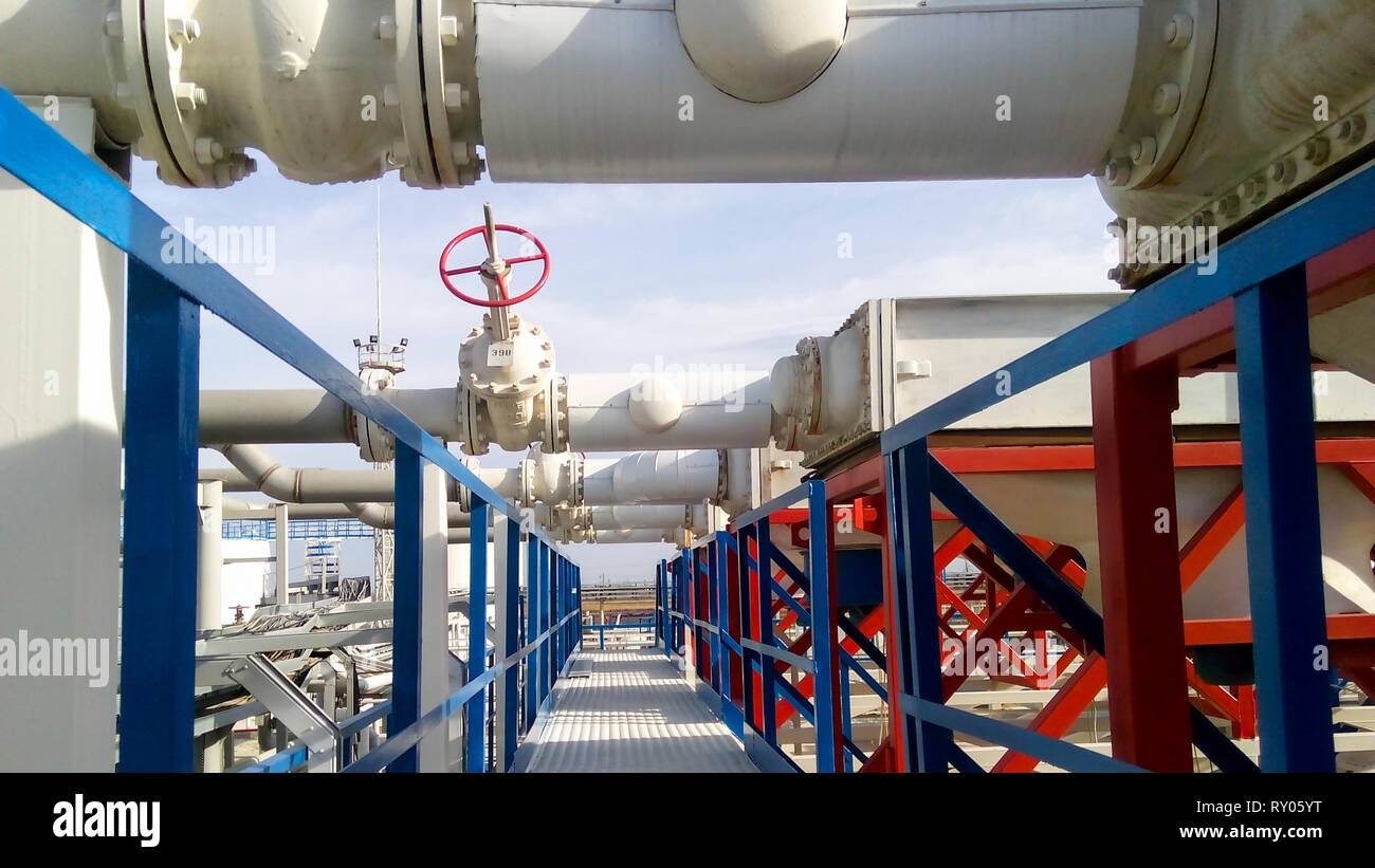 Steel service platform and stairs. Equipment refinery Stock Photo - Alamy