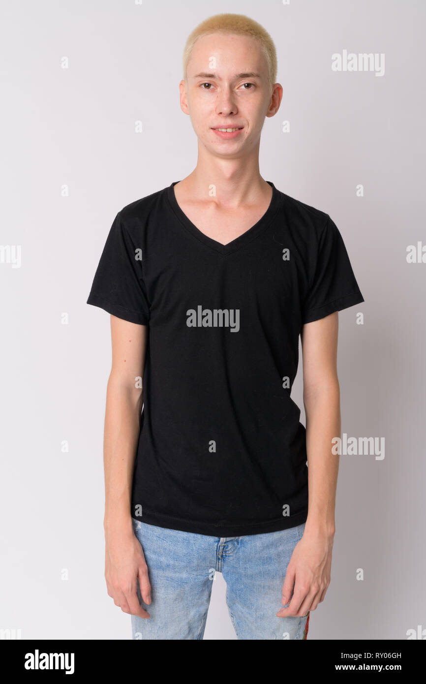 Portrait of happy young handsome androgynous man smiling Stock Photo ...