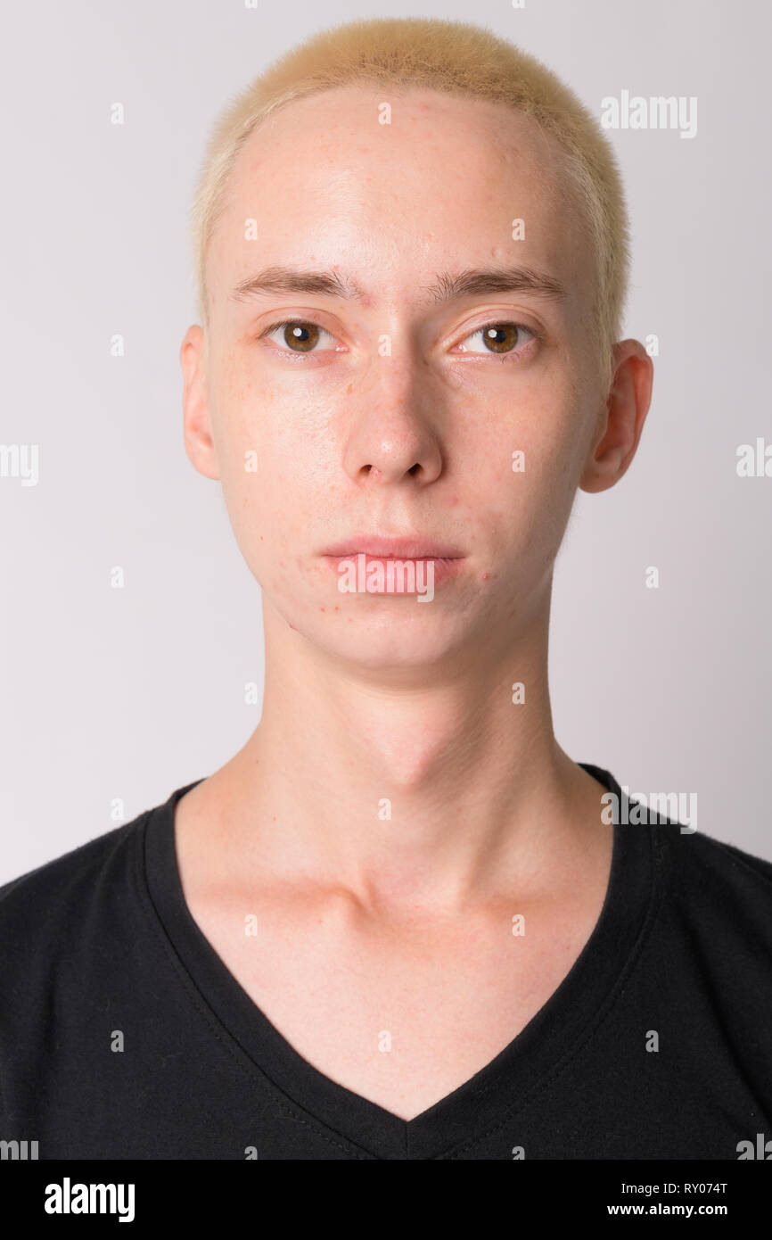 Face of young handsome androgynous man with nose ring Stock Photo - Alamy