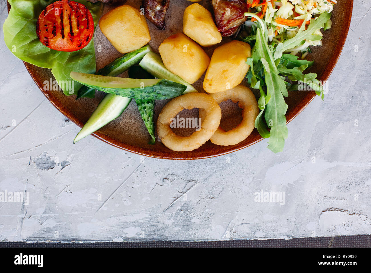 Top view of clay plate full of appetizers for beer Stock Photo - Alamy