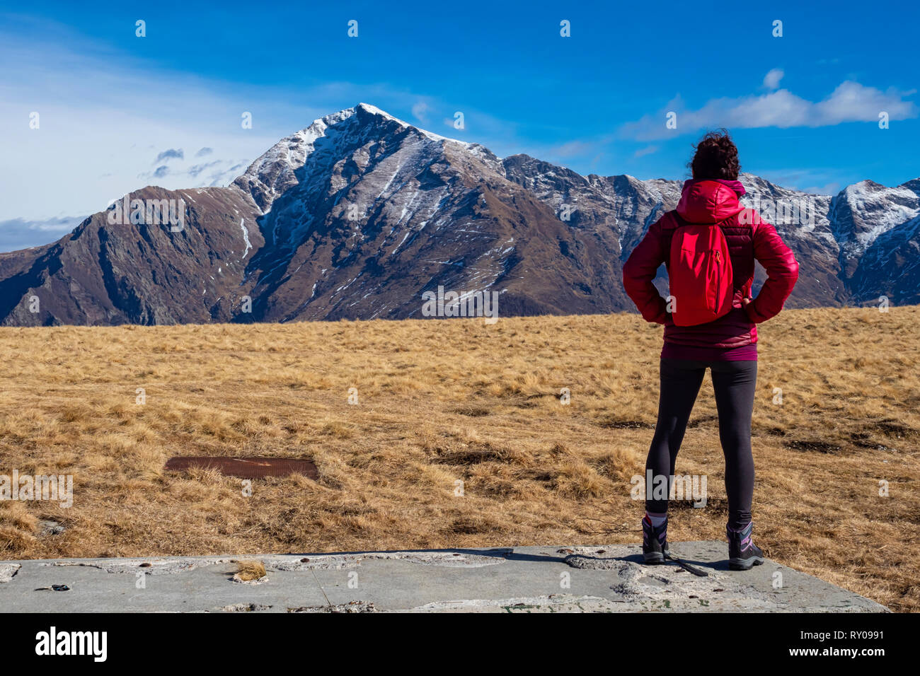 Backpacker girl in the alps Stock Photo - Alamy