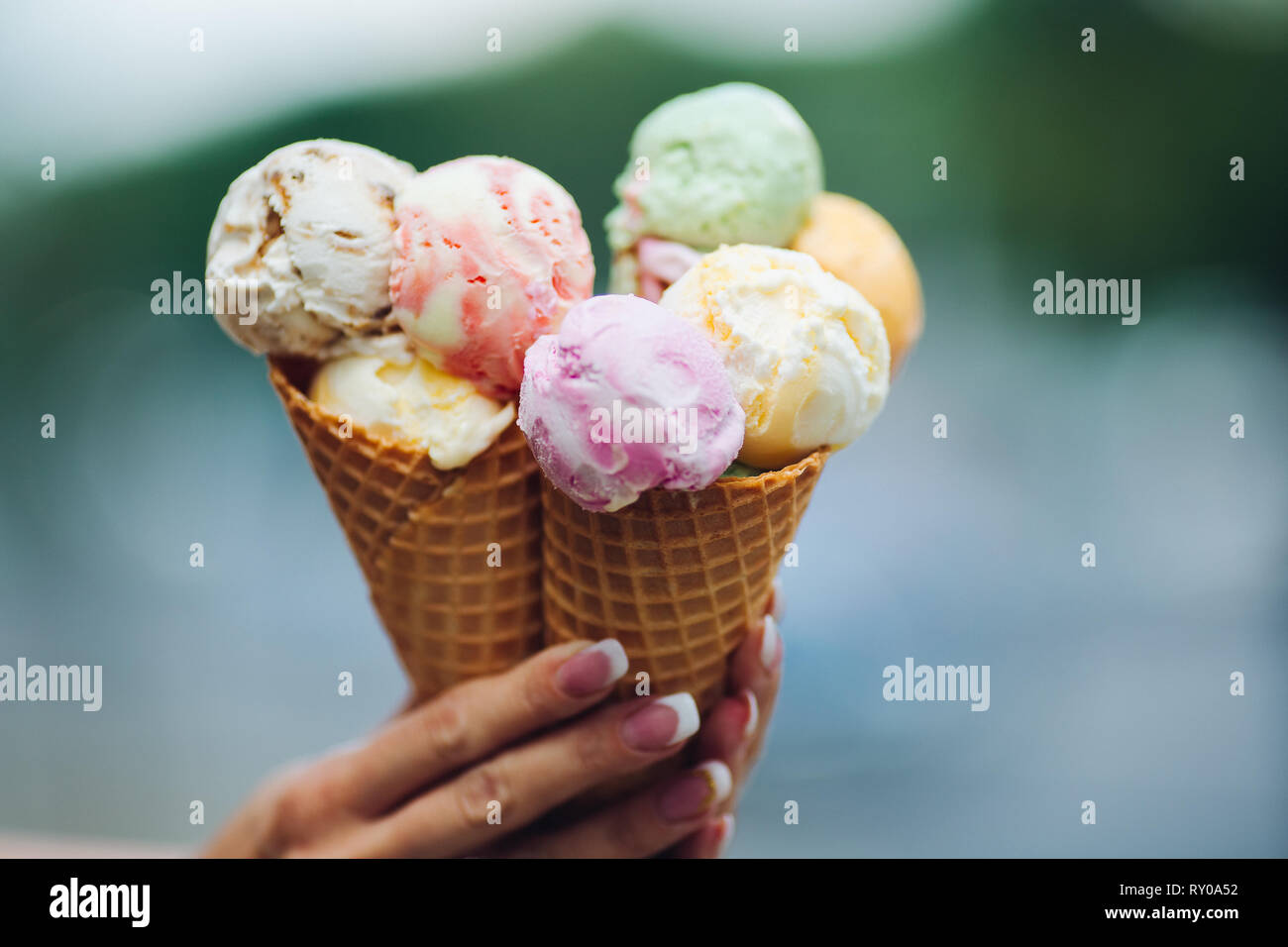 Woman's hand ice cream cone hi-res stock photography and images - Alamy
