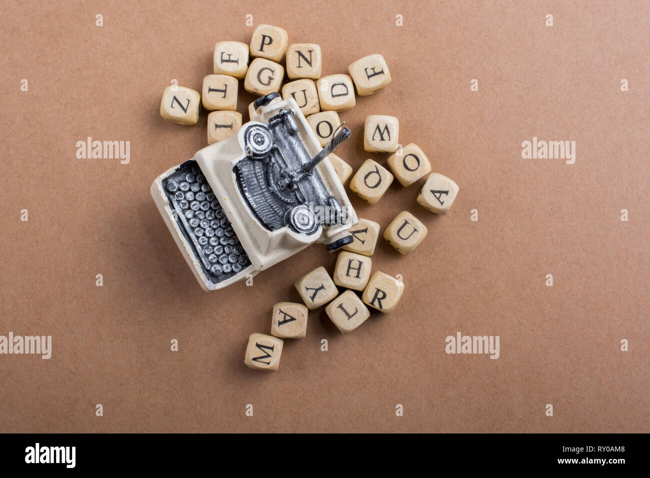 Letter cubes of made of wood around model typewritter Stock Photo - Alamy