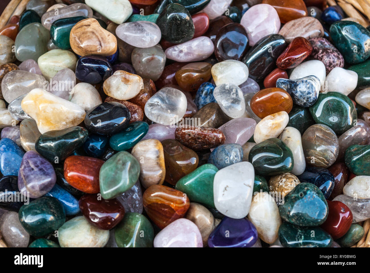 lots of colourful polished gemstones texture background Stock Photo - Alamy