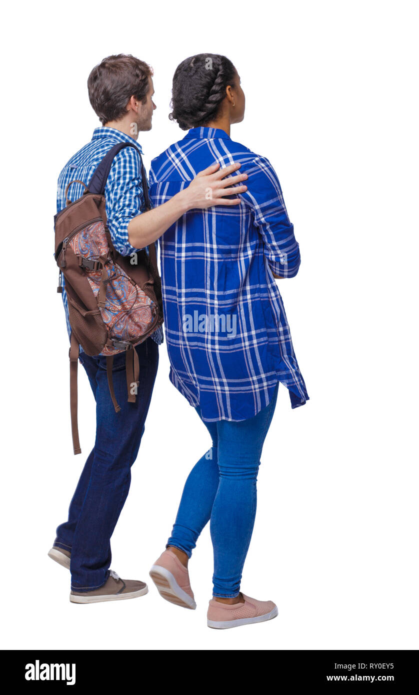 Back view of interracial going couple. walking friendly girl and guy ...