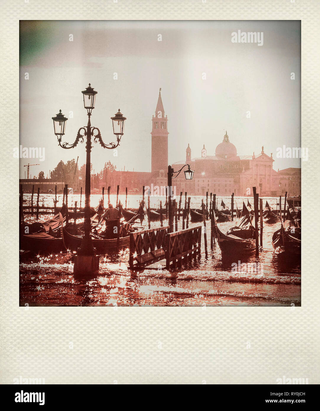 Venetian waterfront with gondolas and iconic landmarks during sunset ...