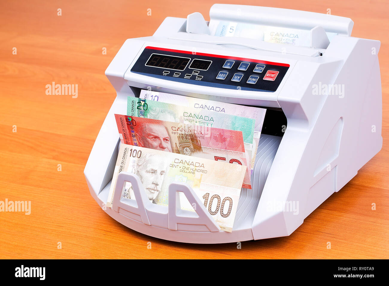 Canadian dollars bills calculator hi-res stock photography and images ...