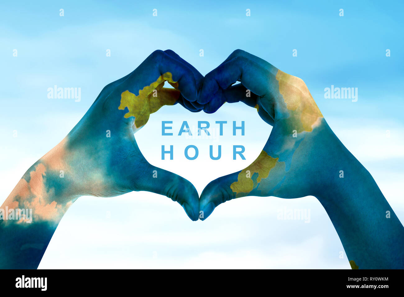 Human hands with world map skin make a heart shape with earth hour text ...