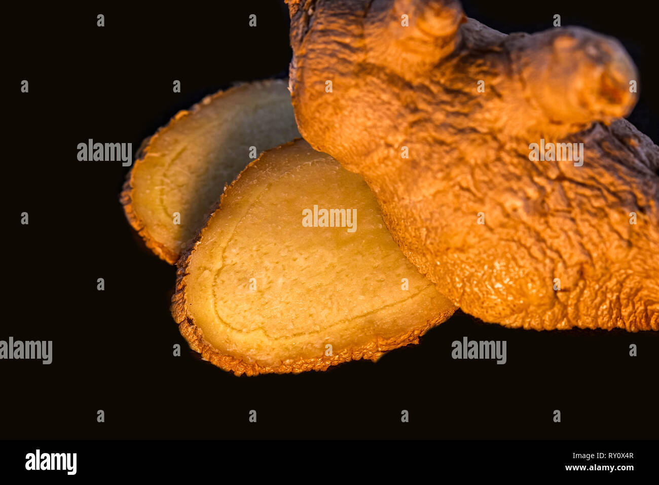 ginger slices closeup detail background Stock Photo - Alamy