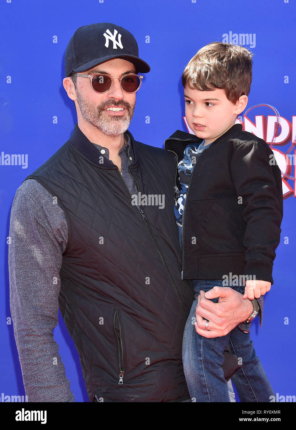 WESTWOOD, CA - MARCH 10: Reid Scott (L) and son Conrad Scott arrive for ...