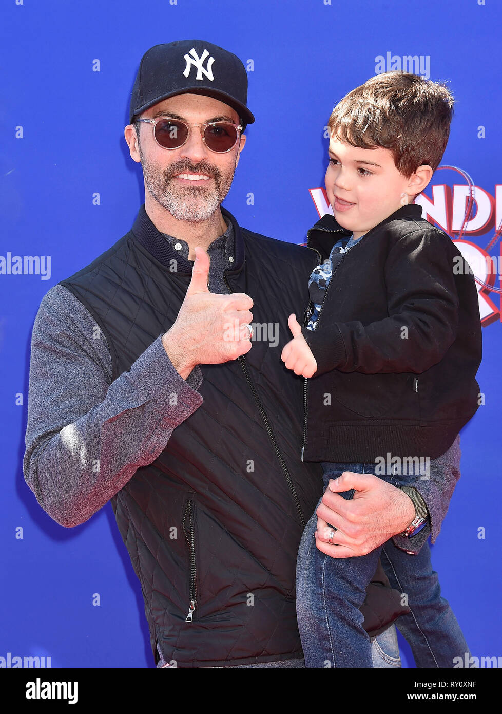 WESTWOOD, CA - MARCH 10: Reid Scott (L) and son Conrad Scott arrive for ...