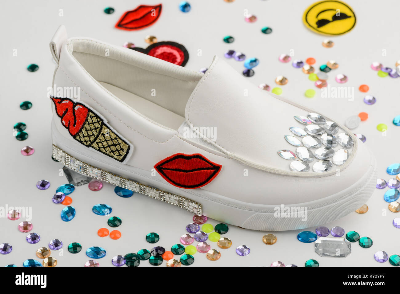 White shoes with sewed patches Stock Photo - Alamy