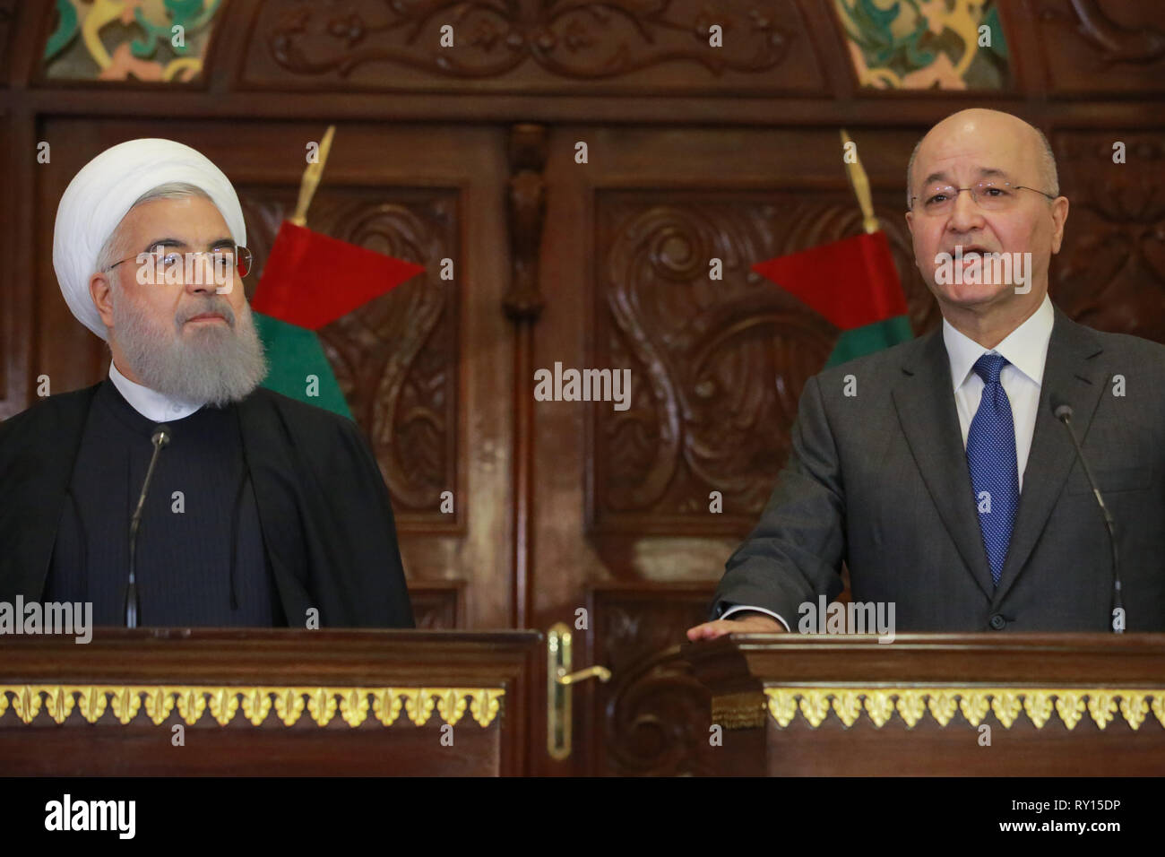 Baghdad, Iraq. 11th Mar, 2019. Iraqi President Barham Salih (R) speaks ...