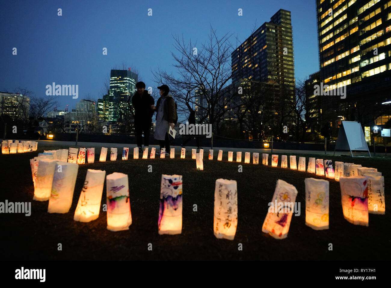 Tokyo, Japan. 11th Mar, 2019. Candles with messages dedicated to the ...
