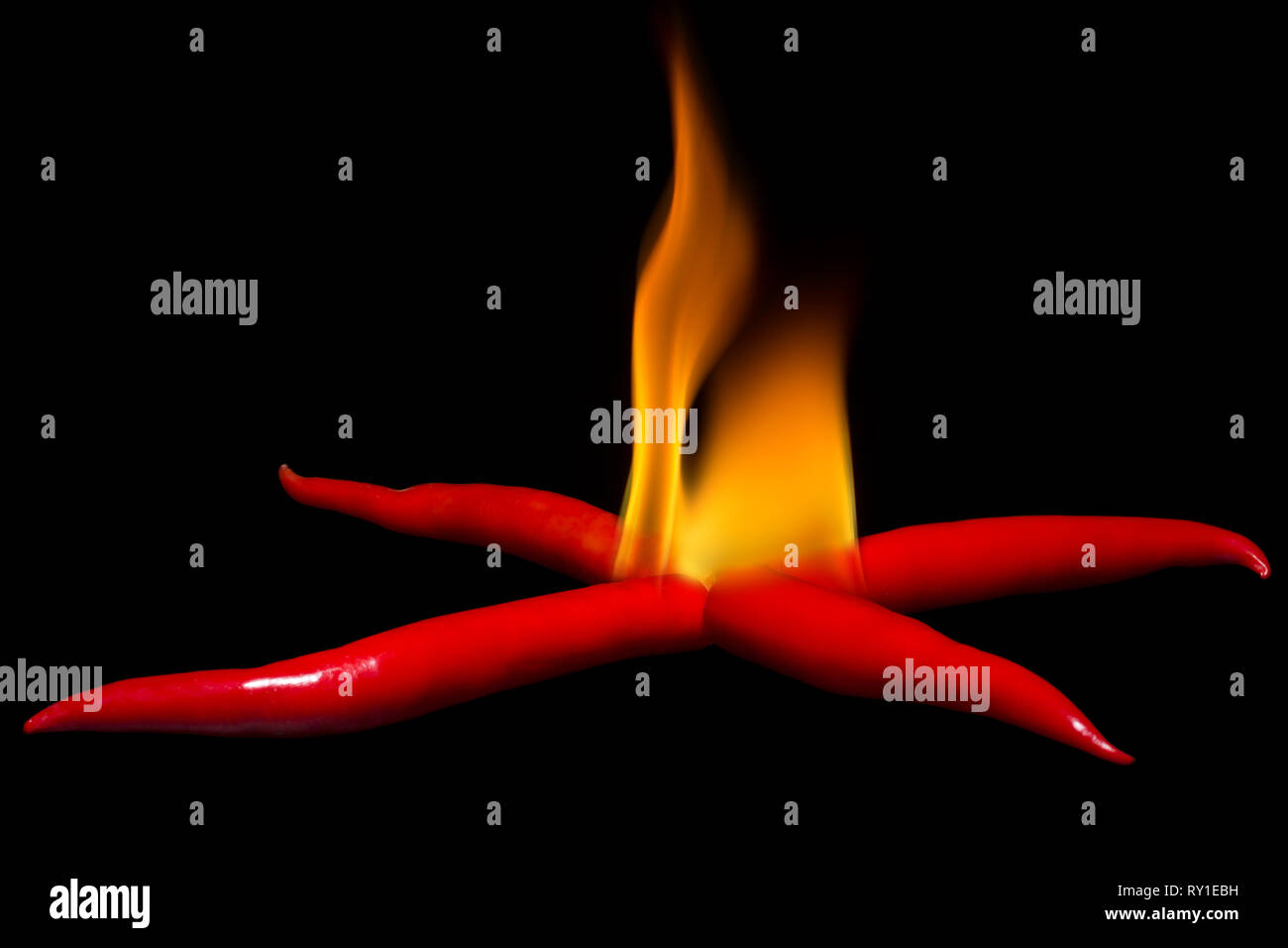 Set fire with chili. Fire on chili pile on dark background Stock Photo ...