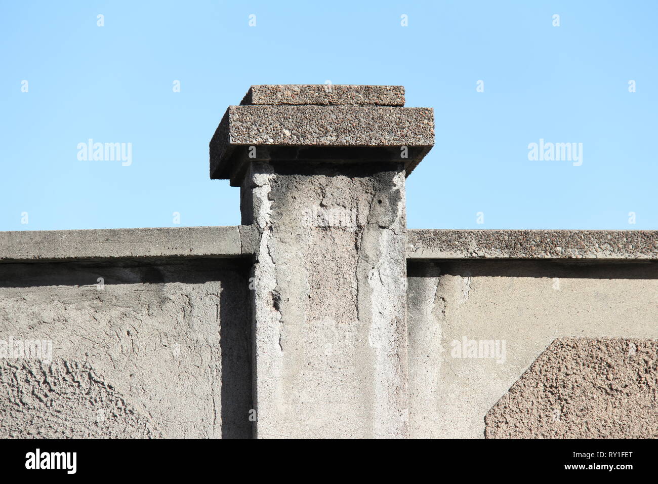 Detail of the concrete wall, the central column holds two parts of the ...