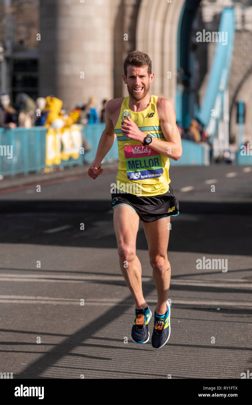 Jonathan Mellor running in the Vitality Big Half half marathon crossing Tower Bridge, London, UK ...