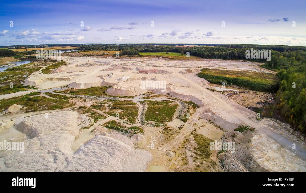 The very big limestone quarry area with lots of white powdered ...