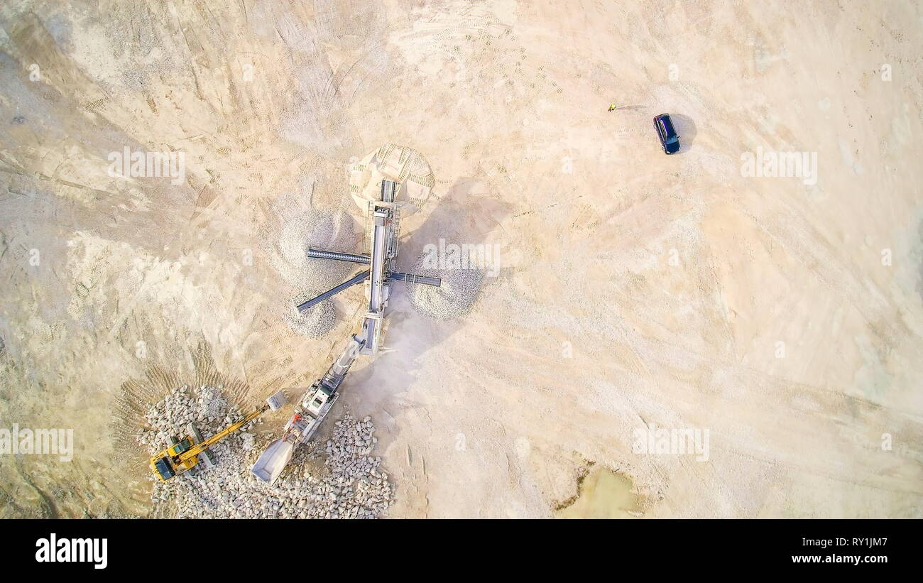 The limestone crusher in the middle of the quarry. This heavy equipment ...