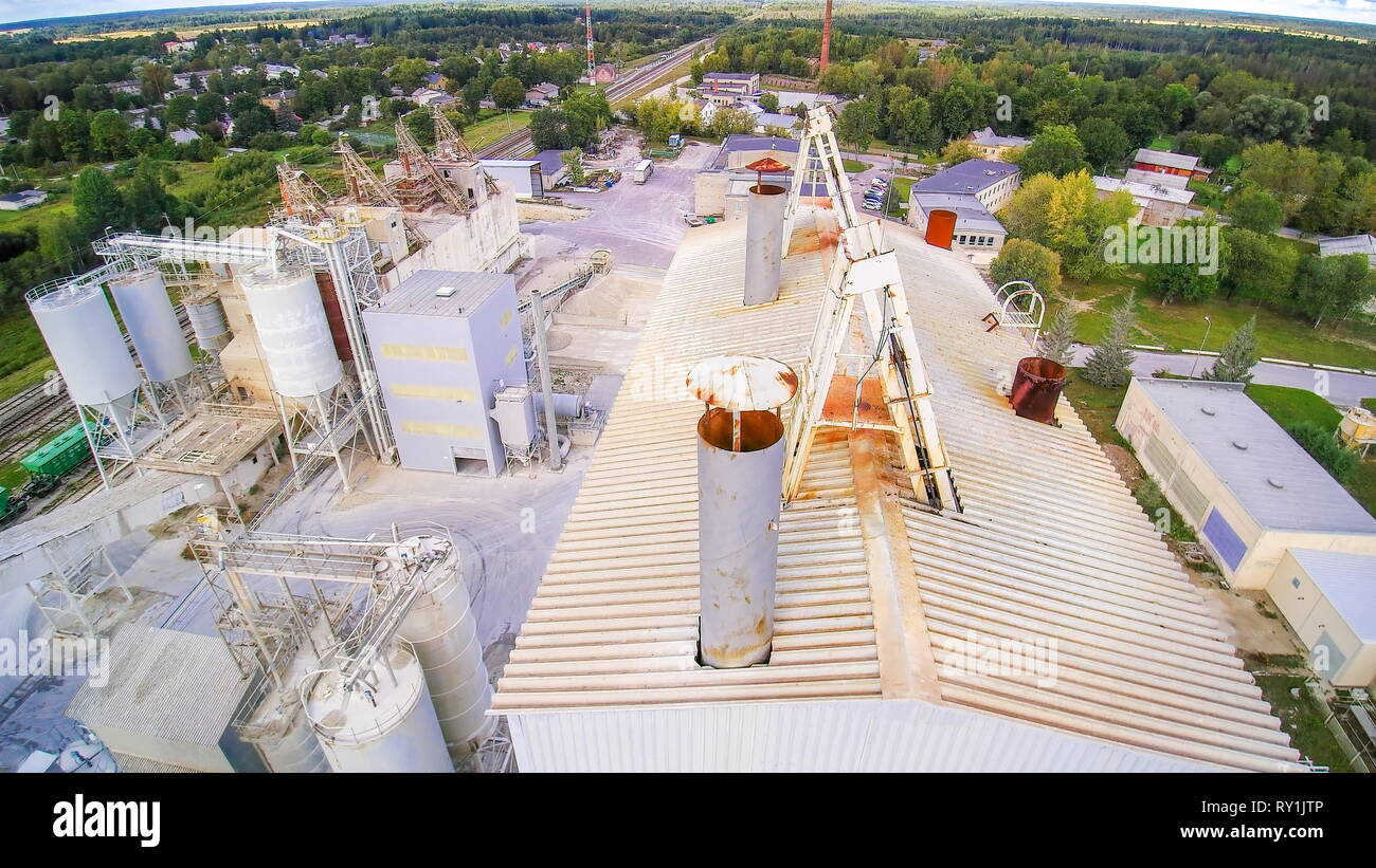 The rusty roof of the production building inside the limestone factory ...