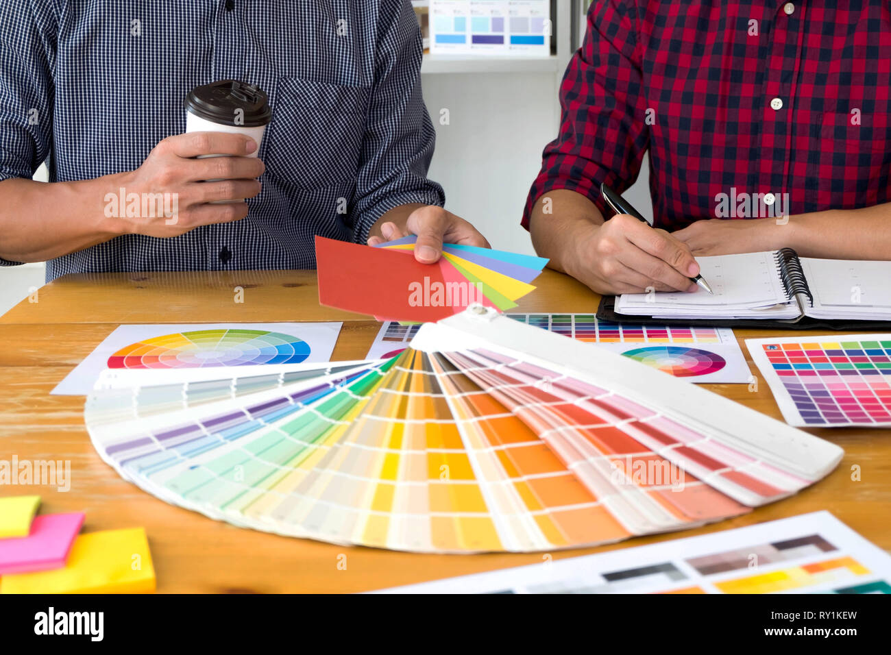 Graphic designers choose colors from the color bands samples for design ...