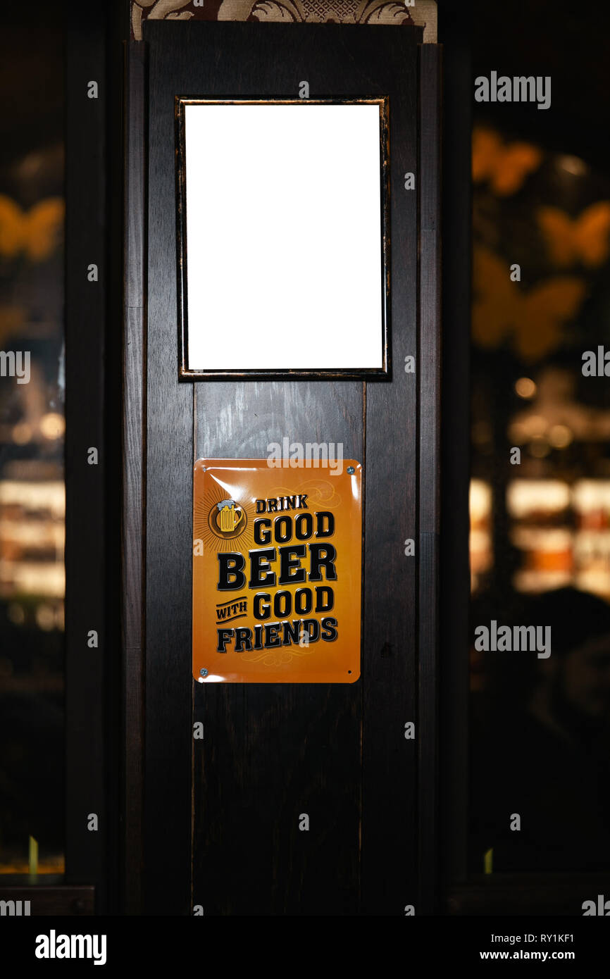 Closeup of a blank whiteboard in pub interior. Mock up, billboard, ad ...