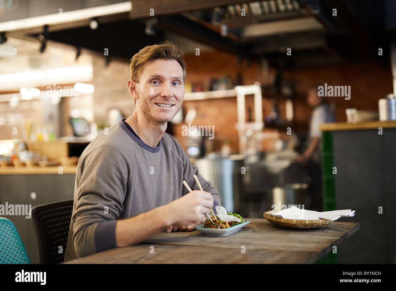 Asian man eating noodles hi-res stock photography and images - Alamy