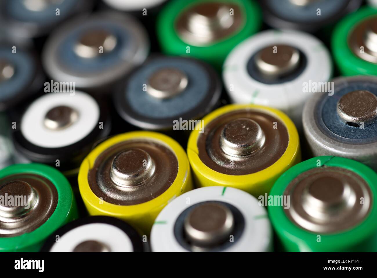 Many batteries on a metal table Stock Photo - Alamy