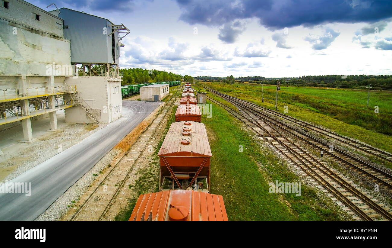 The colorful body of the trains lined up outside the limestone factory ...