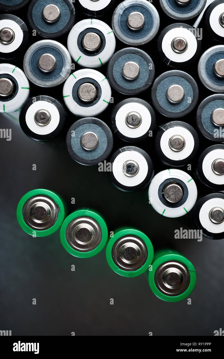 Many batteries on a metal table Stock Photo - Alamy
