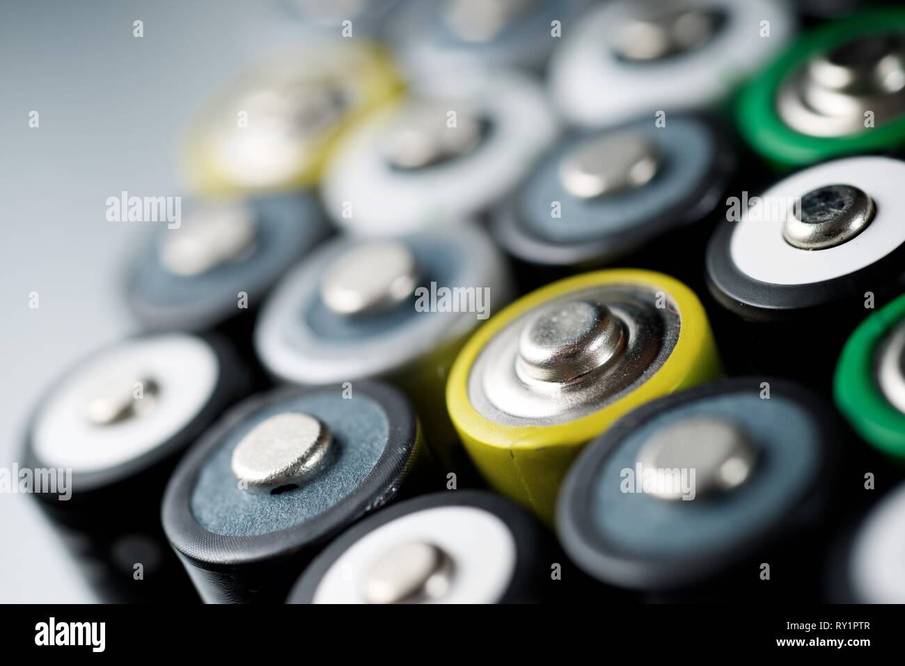 Many batteries on a metal table Stock Photo - Alamy