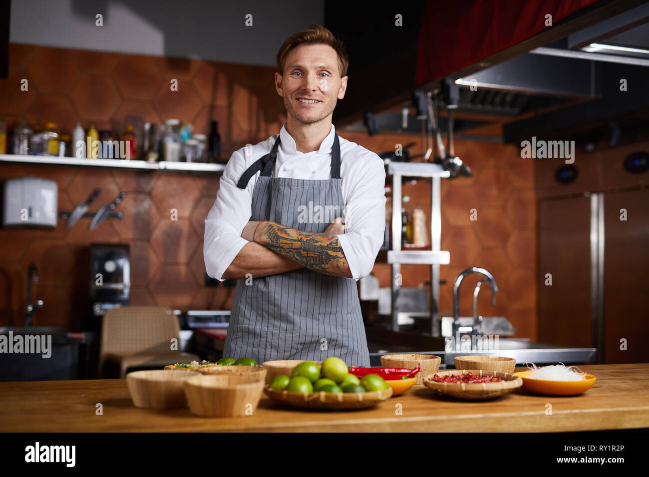 Handsome chef crossed arms posing hi-res stock photography and images ...