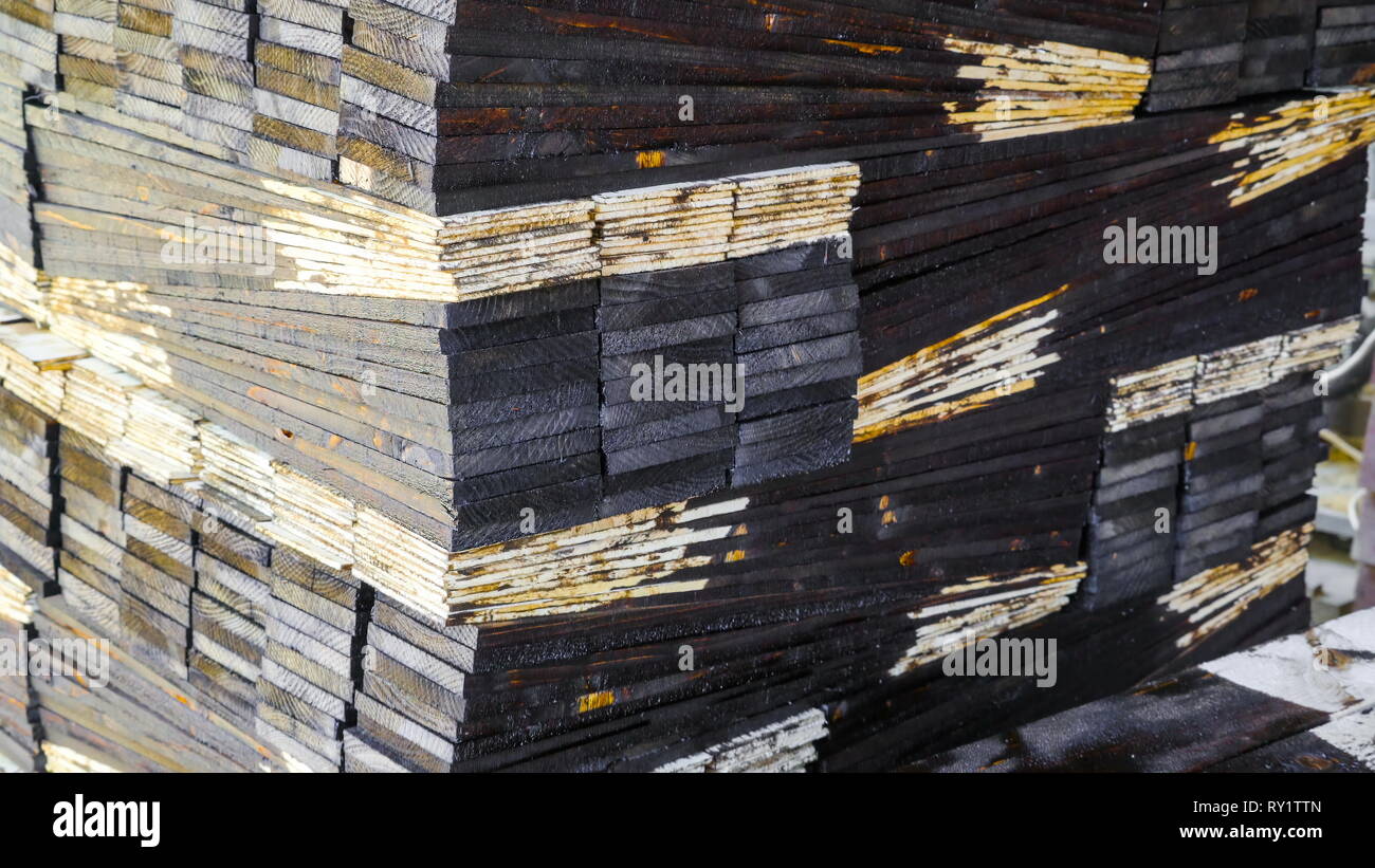 Closer look of the piles of the wooden shingles after being cut by the ...