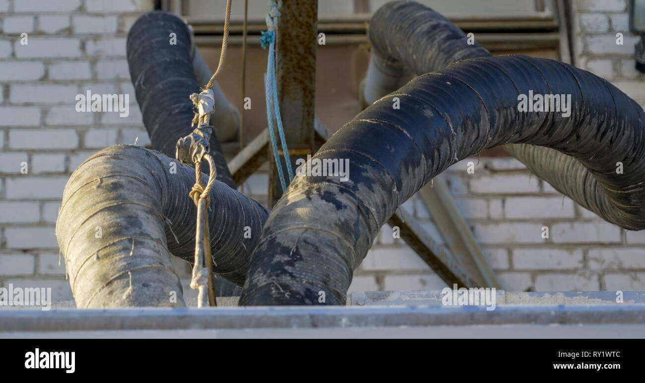 A vibrating big pipe from the truck inside the power plant Stock Photo ...