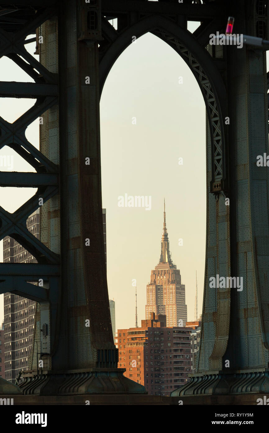 Empire State Building framed by the Manhattan Bridge, as seen from ...
