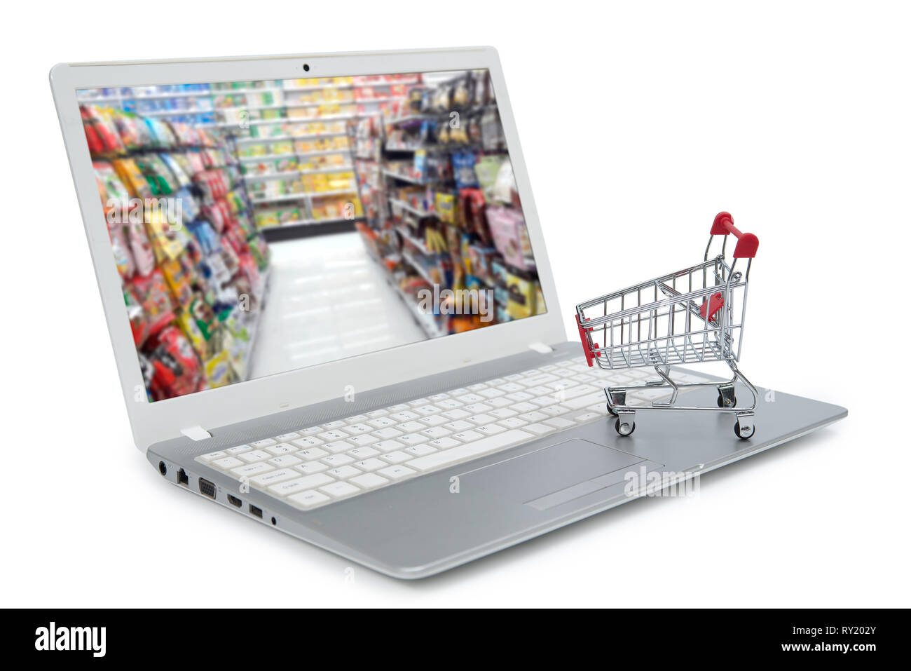 Internet online shopping concept with computer and cart Stock Photo - Alamy
